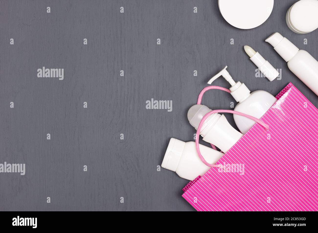 Basic skincare products layout on gray wood table background. Beauty ...