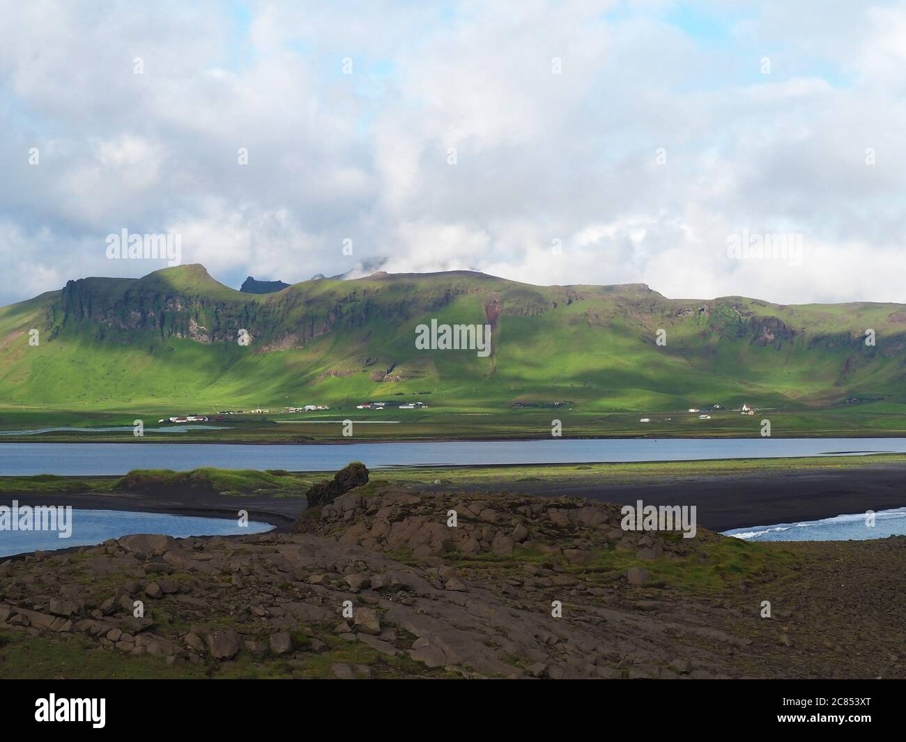 ICELAND, VIK, JULY 23, 2016: View on village vik and sea bay and green ...