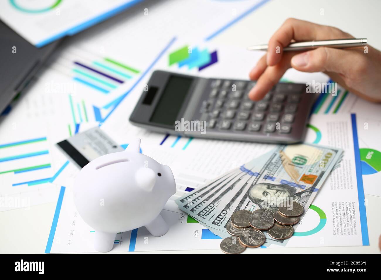Accountant calculating cash and cashless income to company Stock Photo ...