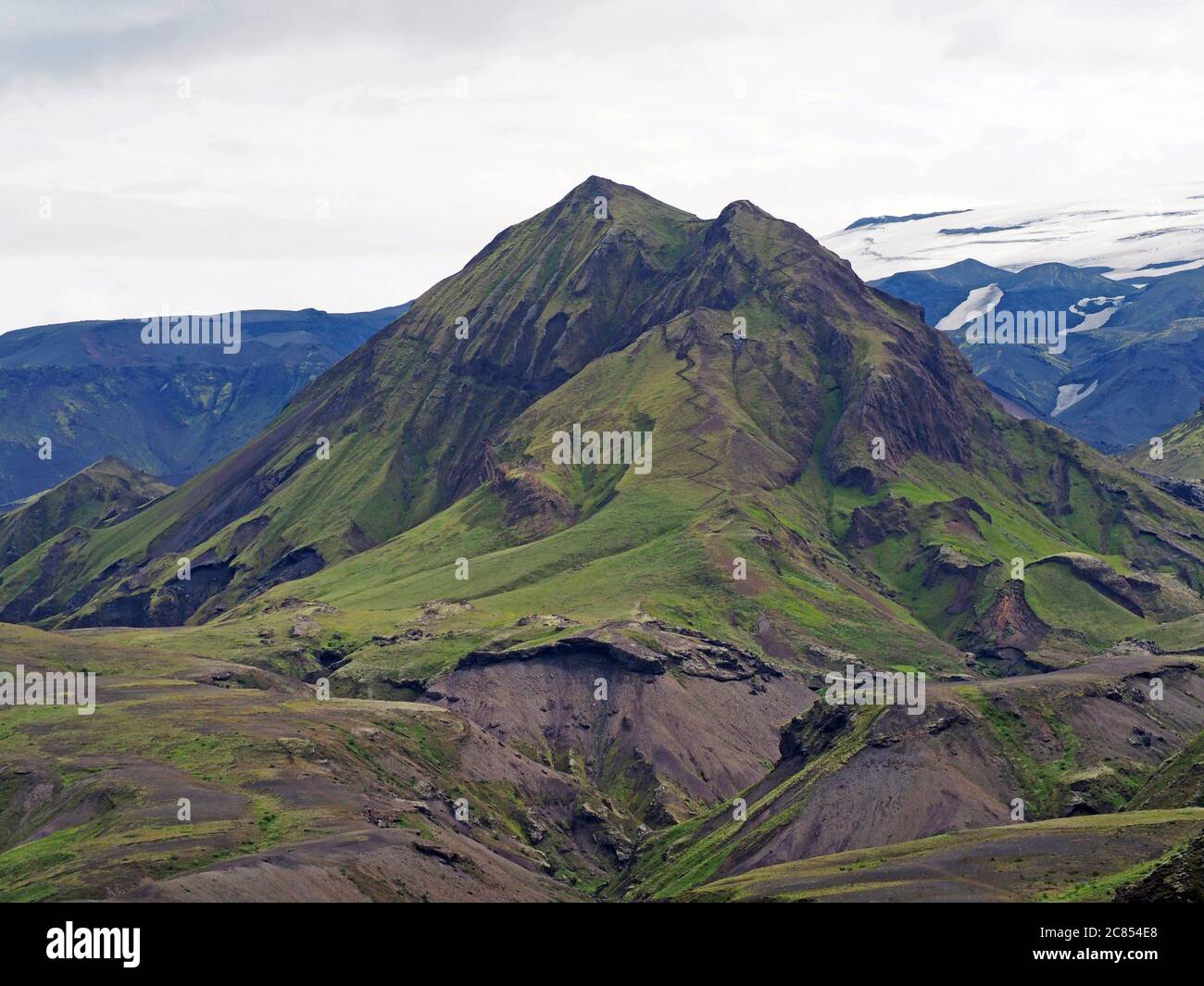 thorsmork national park in iceland - green mountain with steep path and ...