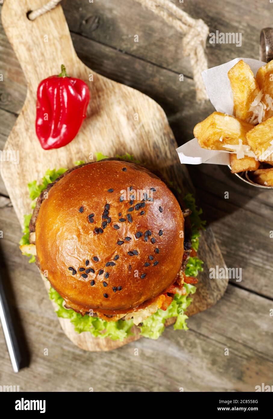 Rustic burger with fries Stock Photo - Alamy