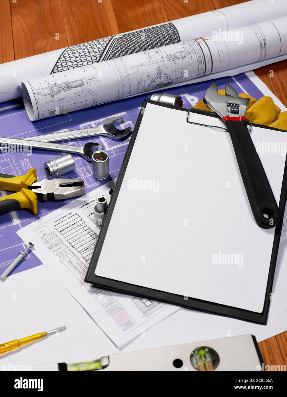 Blank clipboard, blueprints and tools Stock Photo - Alamy