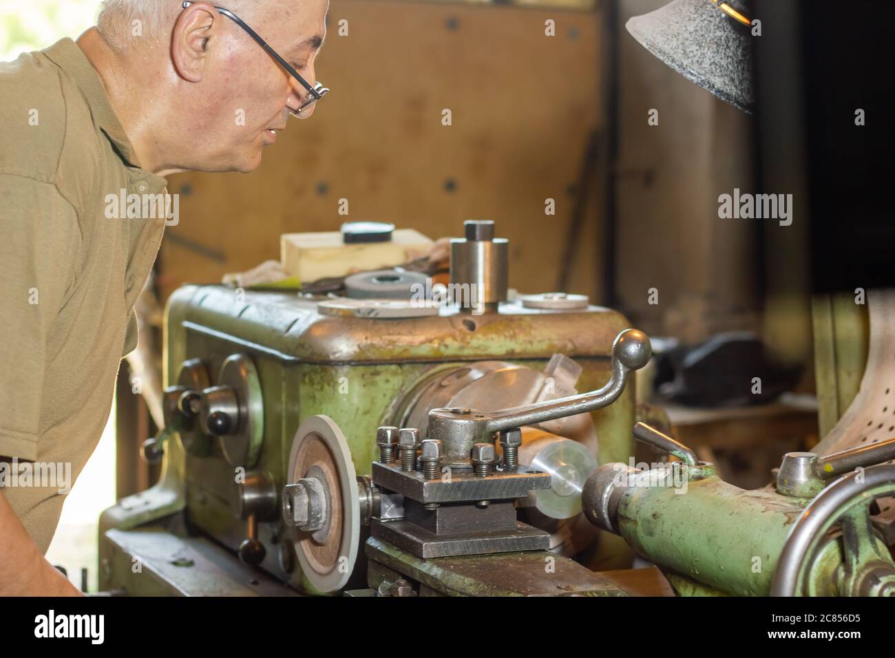 Mechanic working on lathe machine hi-res stock photography and images ...