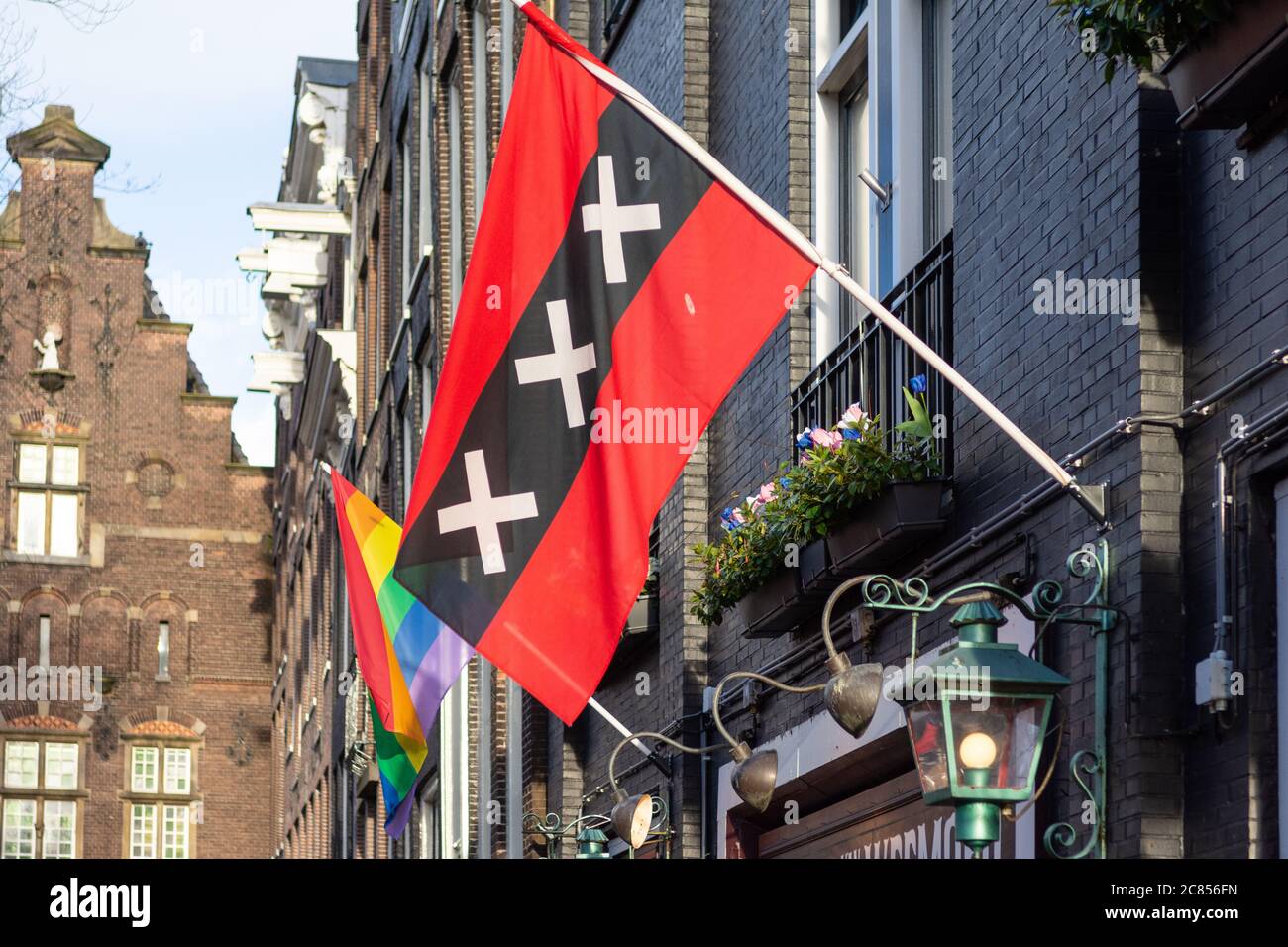 Amsterdam, Netherlands - January 15 2019: A rainbow flag and the flag ...