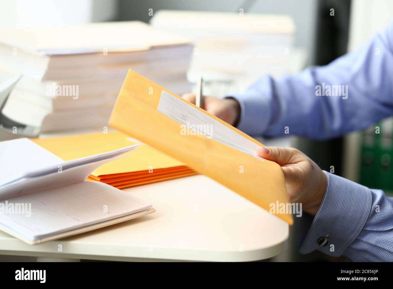 Office manager working with documents and folders Stock Photo - Alamy