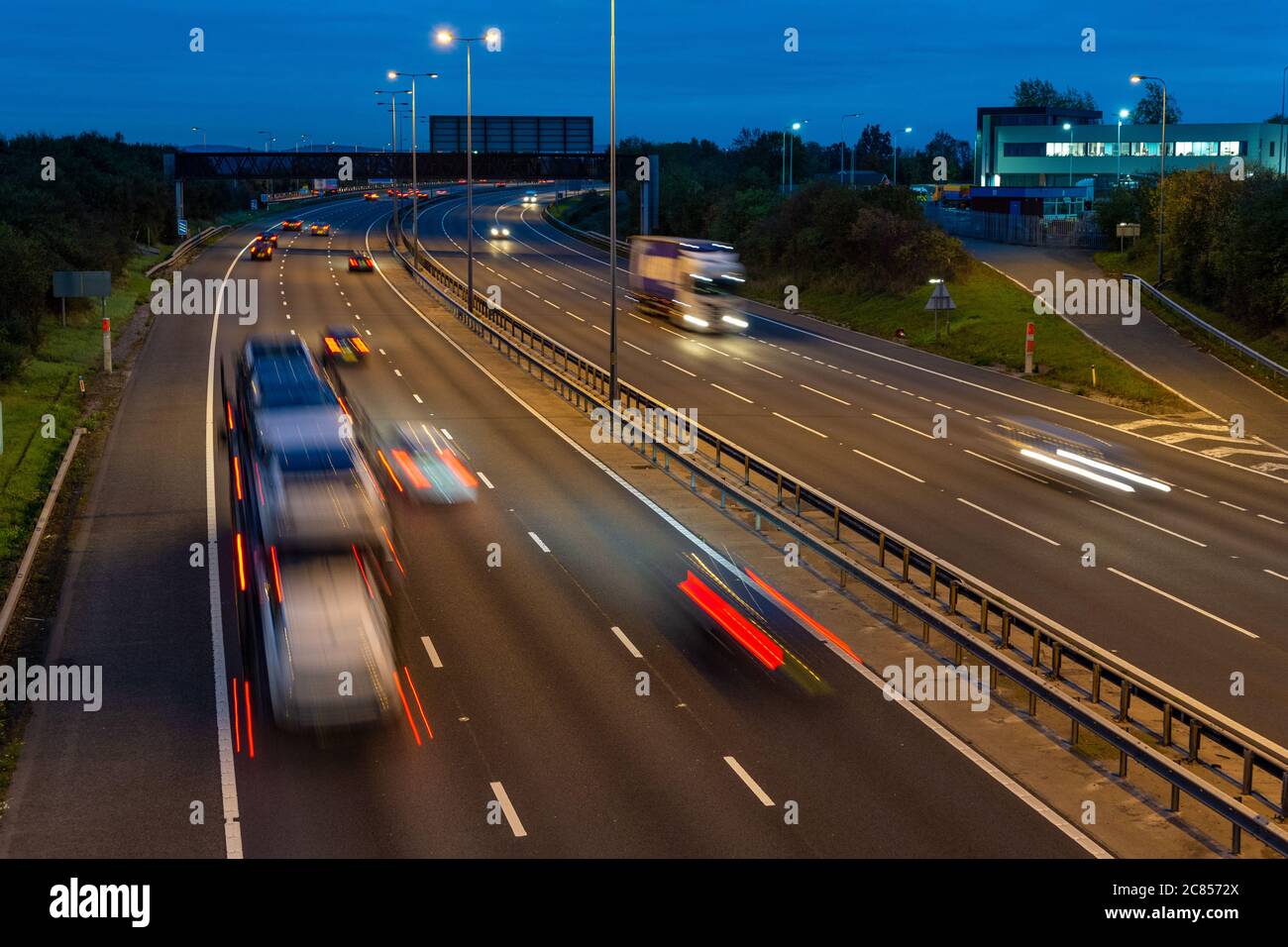 Fast moving traffic speeds along the M5 motorway, Worcestershire during ...
