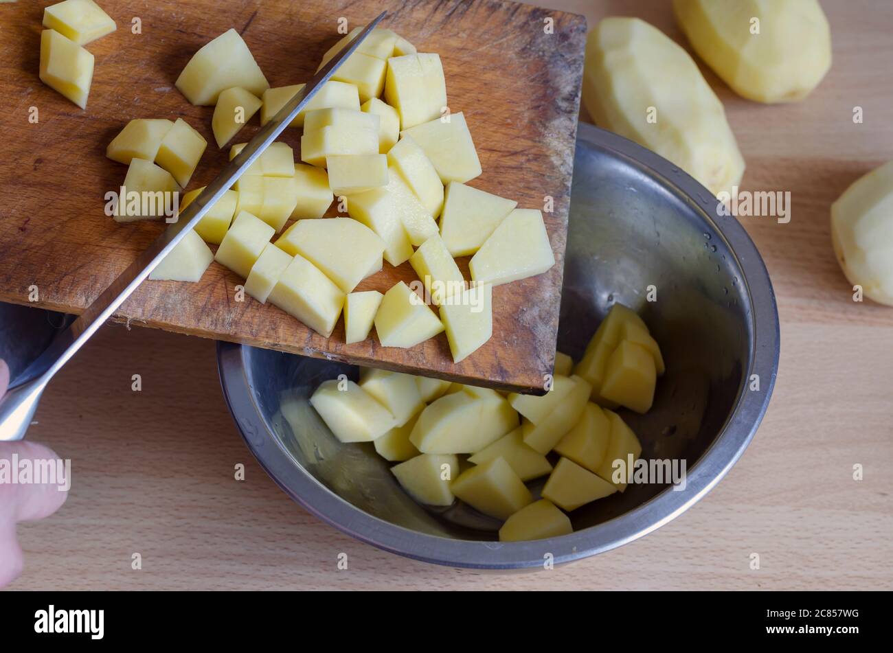 Kitchen cut potatoes cubes potatoes hi-res stock photography and images ...
