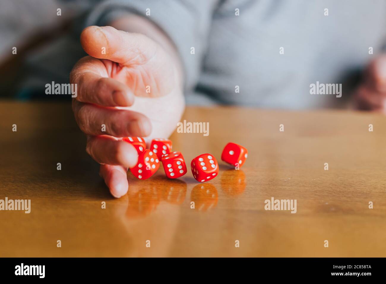 Woman Hand Rolling Dice