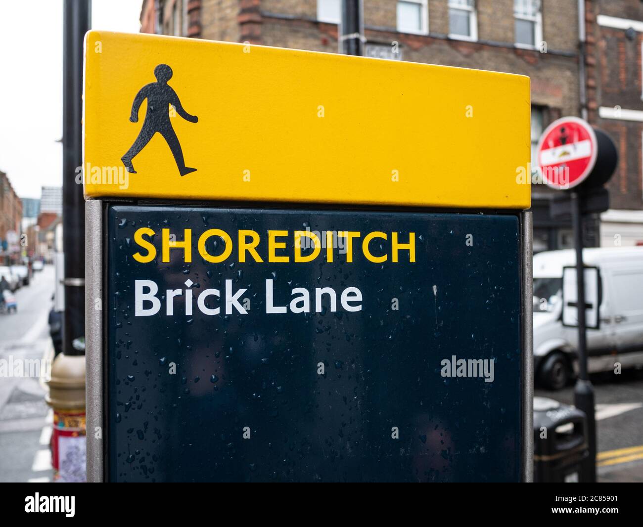 A traffic sign on a busy street in London indicates to pedestrians that ...