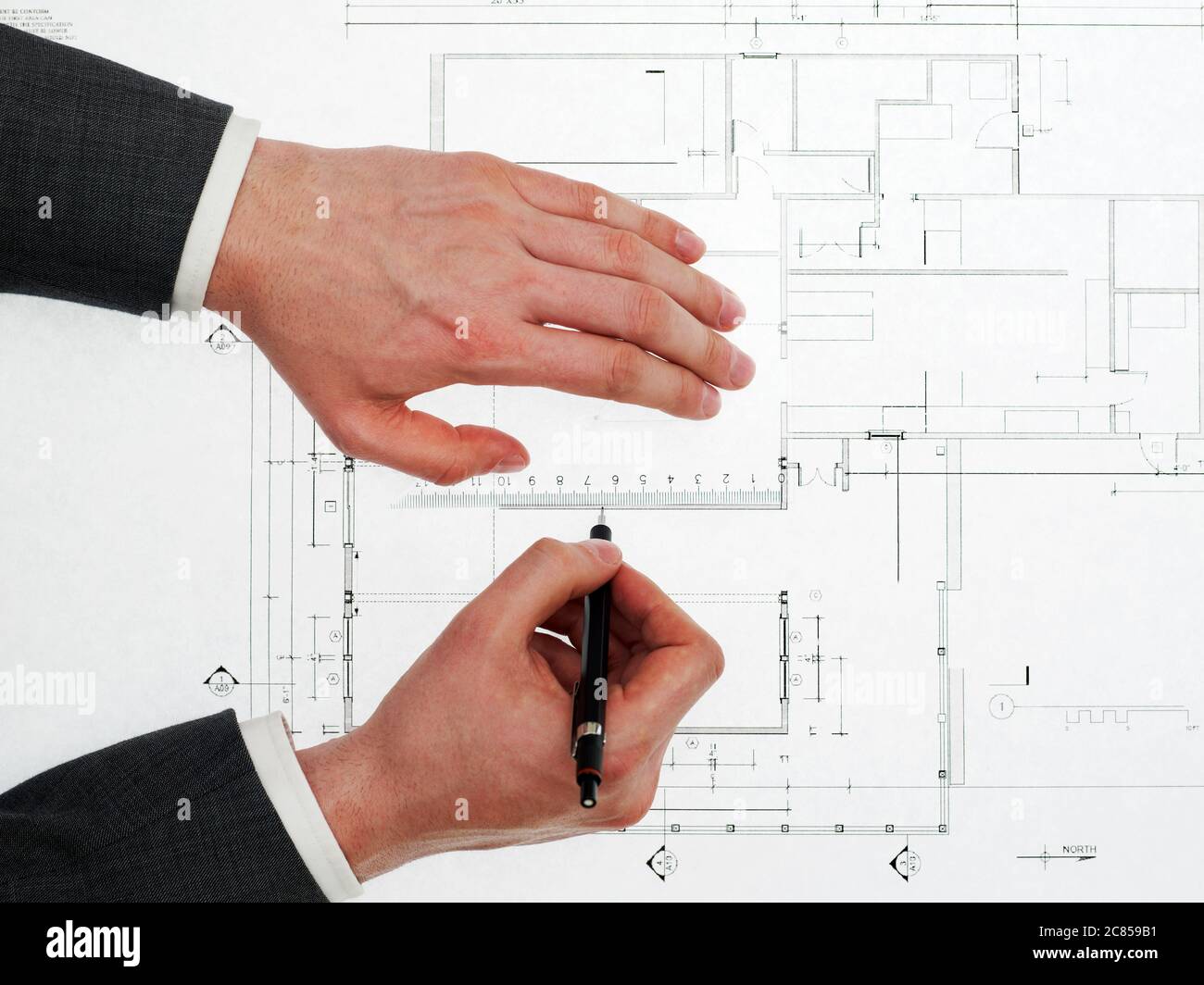 Engineer drawing on blueprints Stock Photo - Alamy