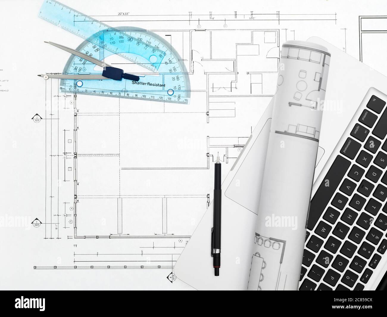 Blueprints, laptop and drawing compass Stock Photo - Alamy