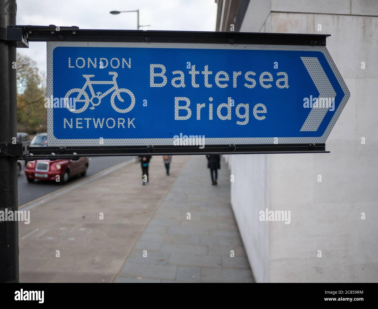 A blue cycle network sign in central London directs cyclists towards ...