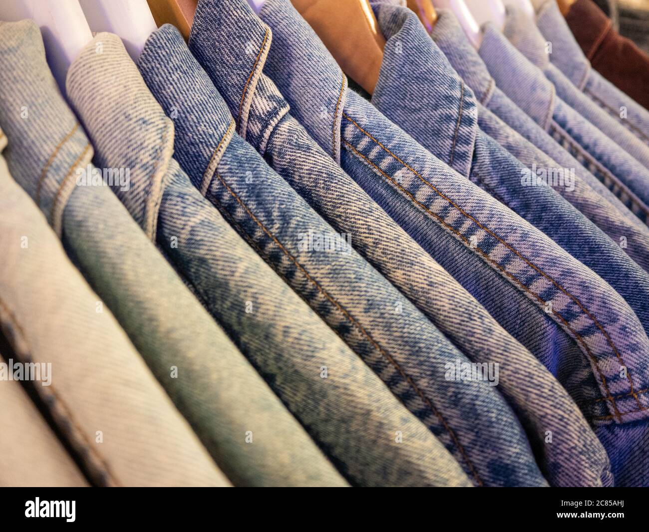 A selection of denim jackets hanging on a rail illustrate the different ...
