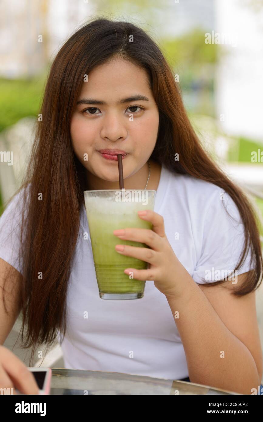 Female student drink green tea hi-res stock photography and images - Alamy