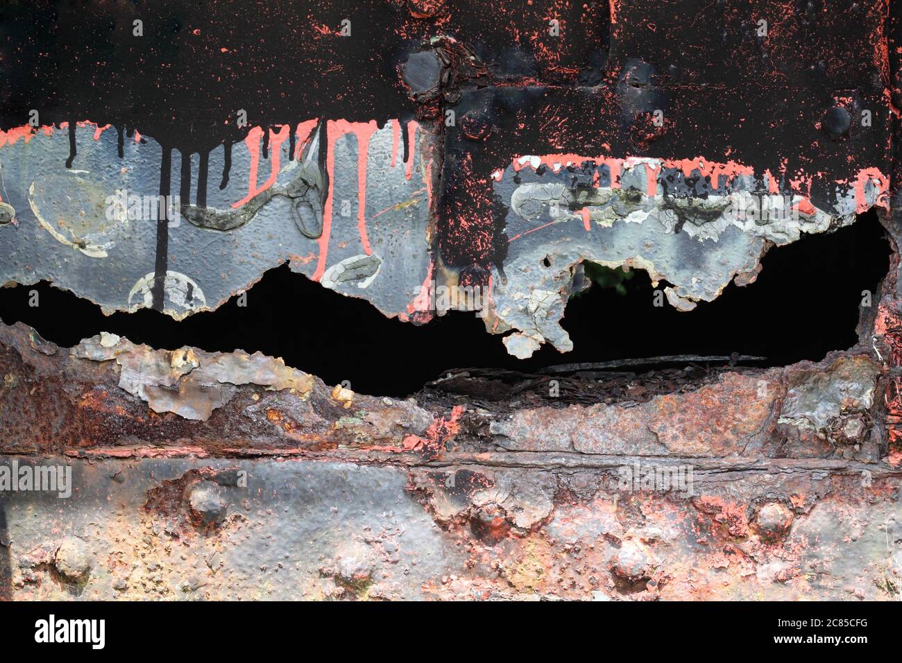 Background texture of an old distressed cracked iron panel covered in ...