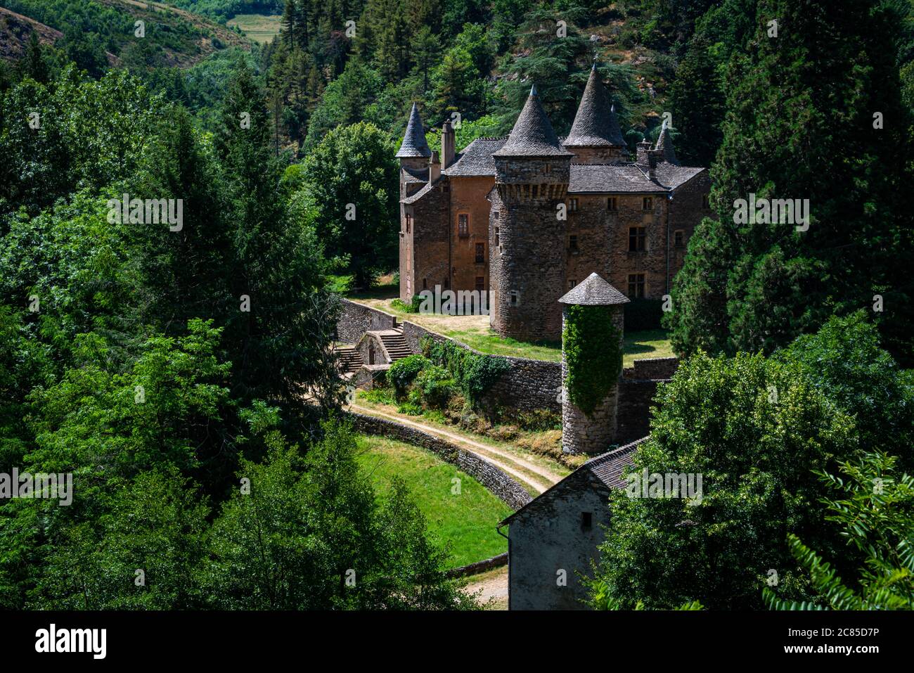 the chateau de champ , lozere, france ,hidden in the valley a well ...