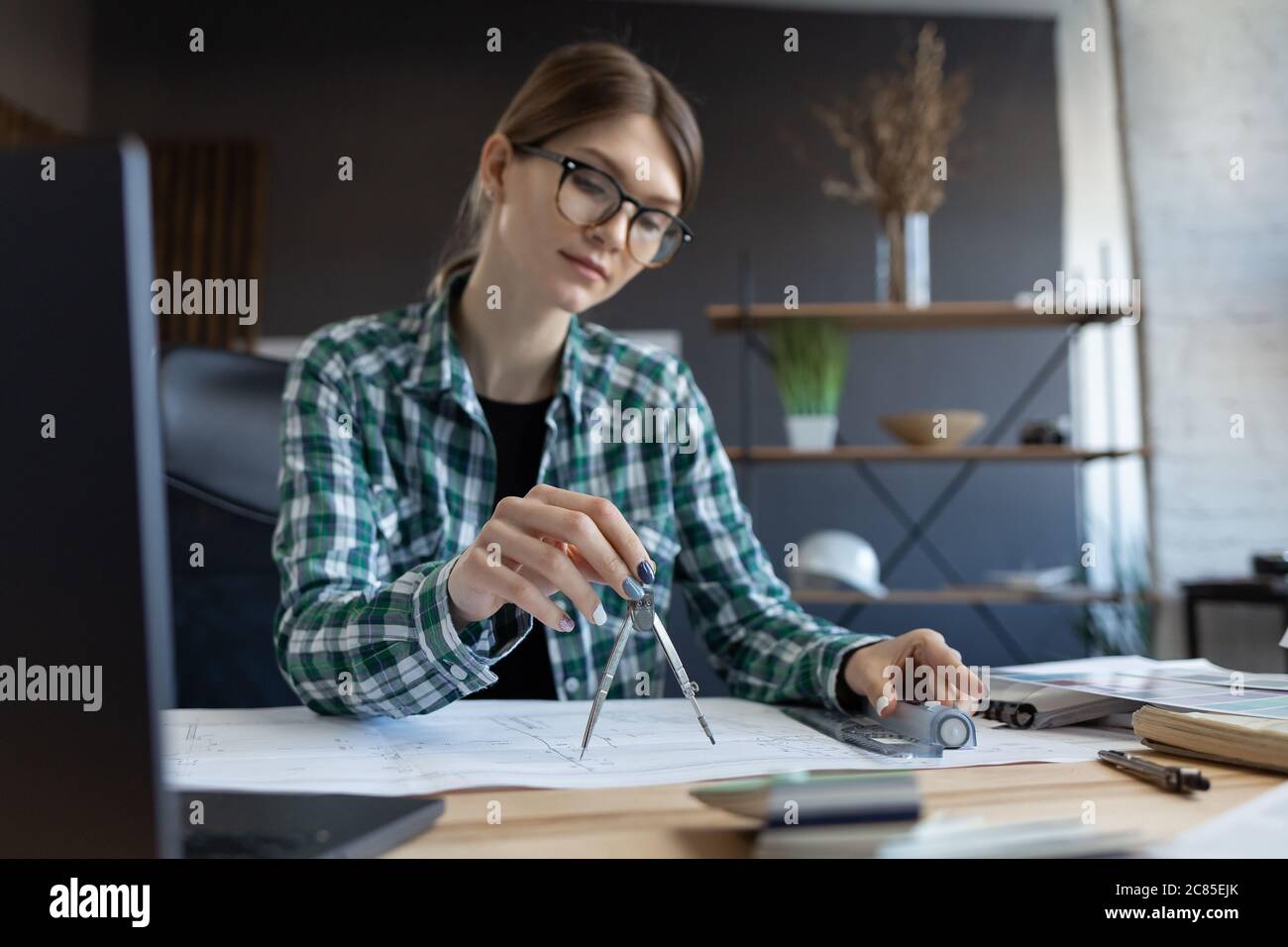 Architect drawing blueprints in office. Engineer sketching a ...