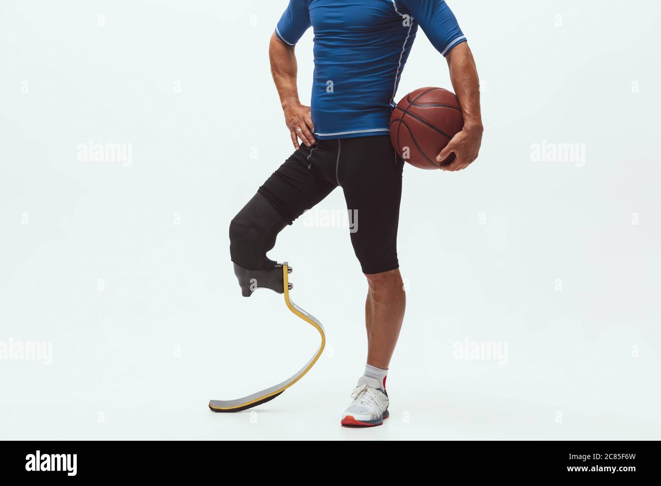 Athlete with disabilities or amputee on white studio background ...