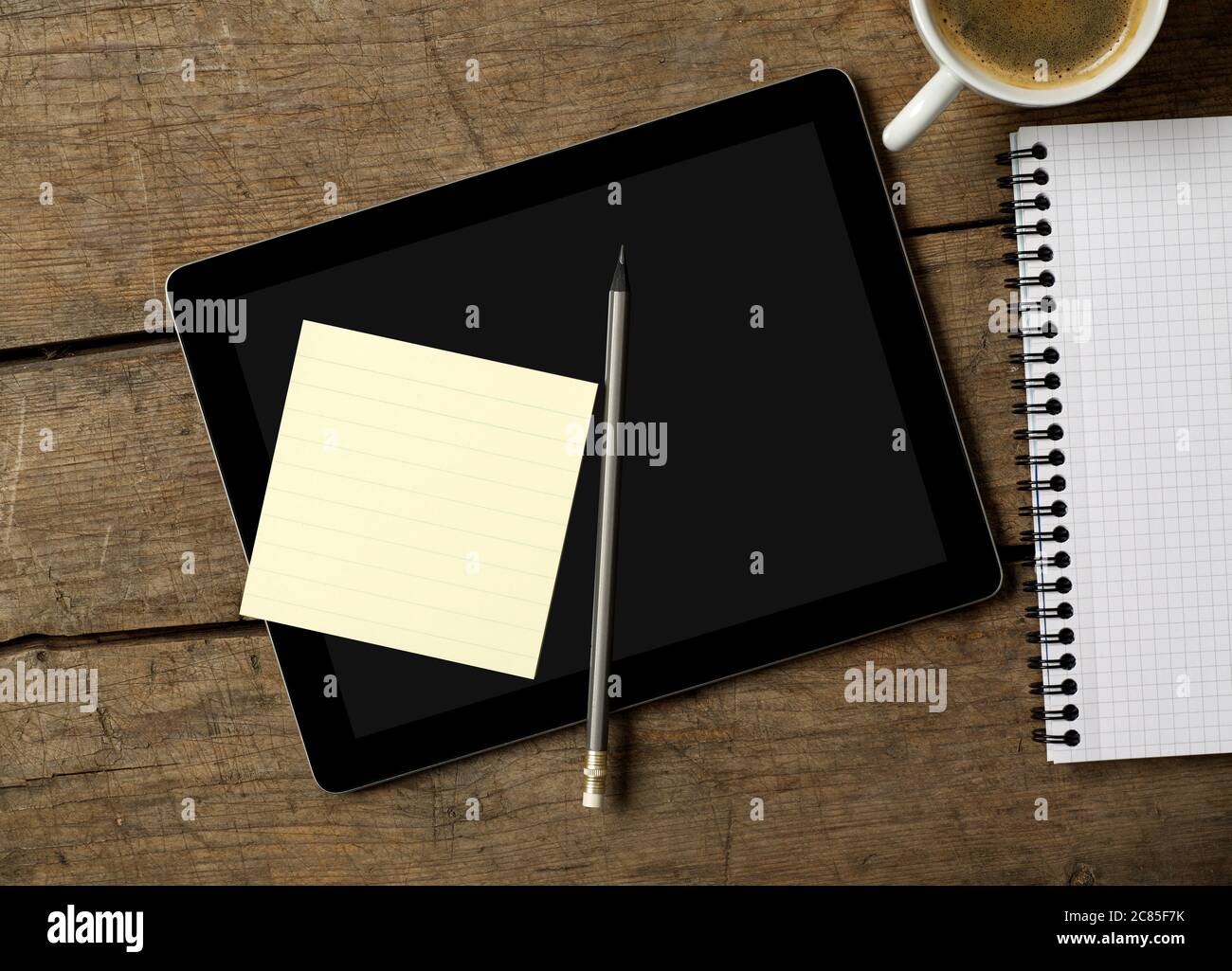 Adhesive notes and digital tablet on desk Stock Photo - Alamy