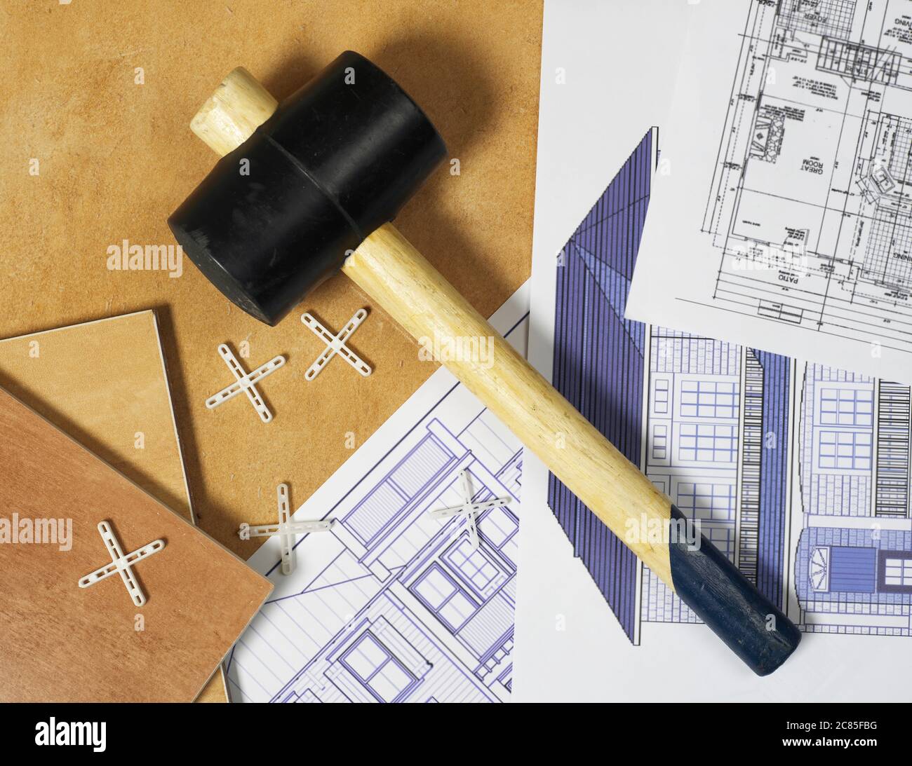 Hammer, blueprints and tiles Stock Photo - Alamy