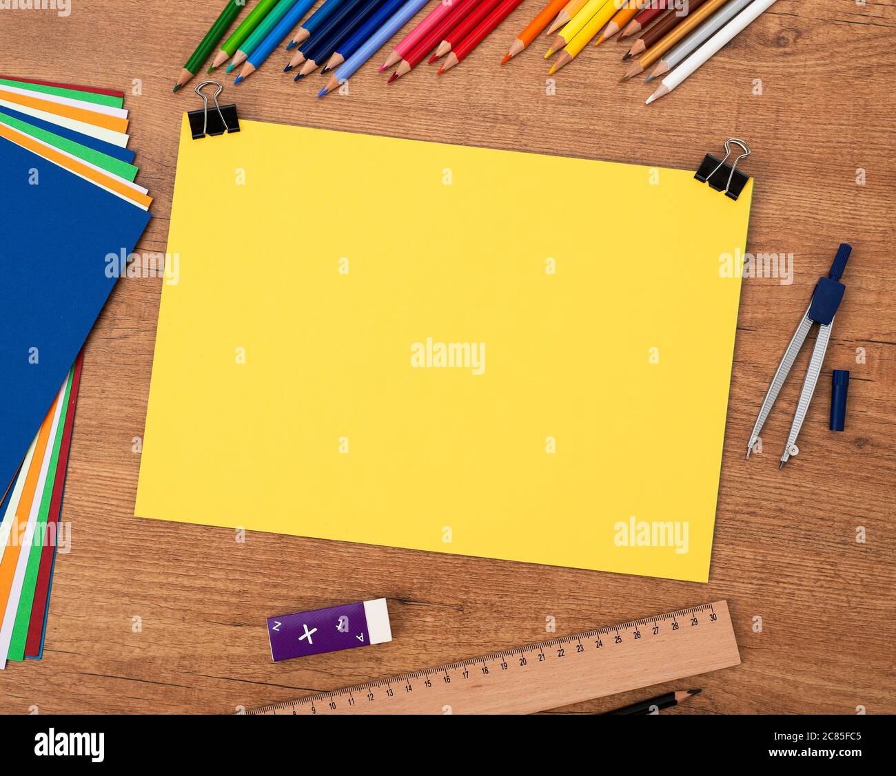 Blank yellow paper on desk Stock Photo - Alamy