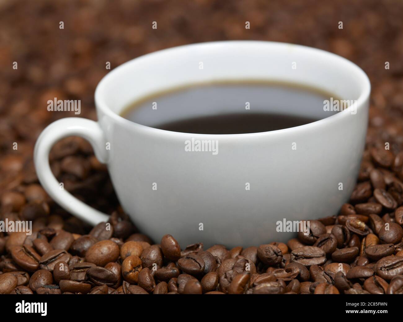 Coffee cup on a rustic background Stock Photo - Alamy