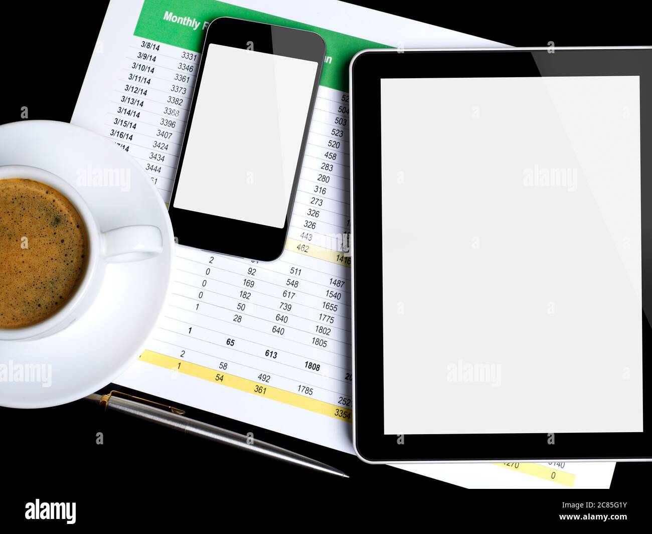 Digital tablet and mobile phone on desk Stock Photo - Alamy