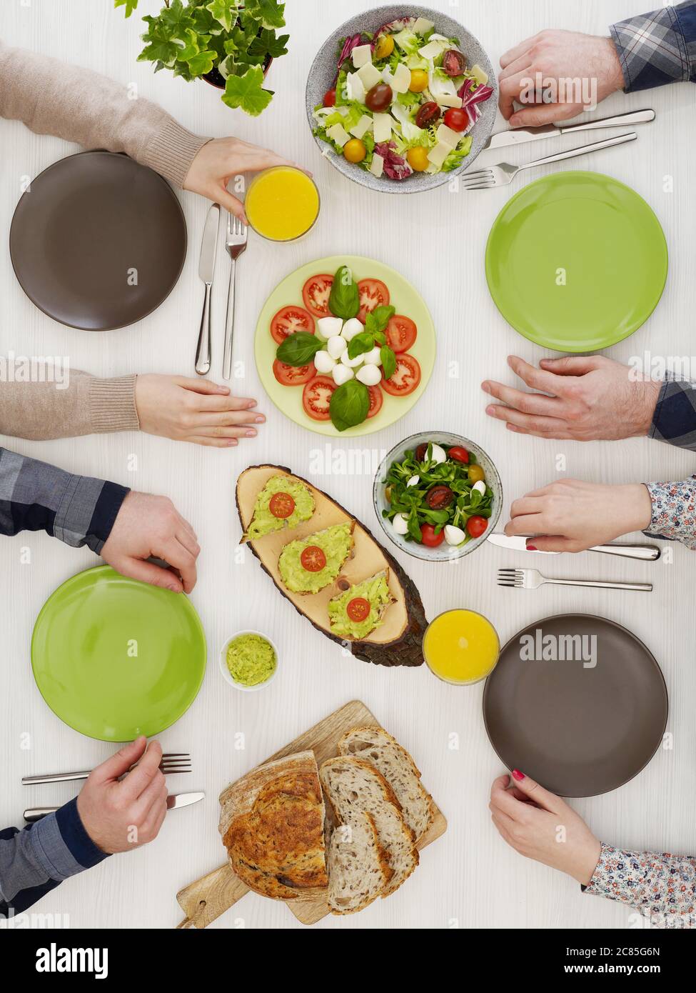 People at dinner table Stock Photo - Alamy