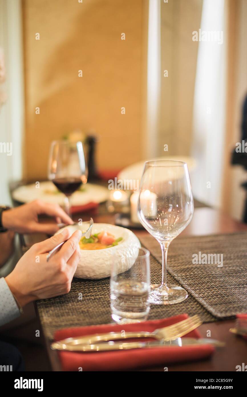 Happy young couple eating pastries in a pastry shop Stock Photo - Alamy