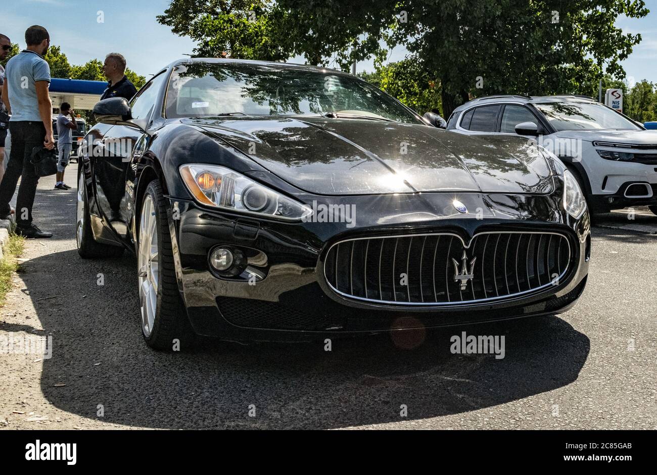RUMA, SERBIA - Aug 06, 2019: Beautiful maserati car with people and a ...