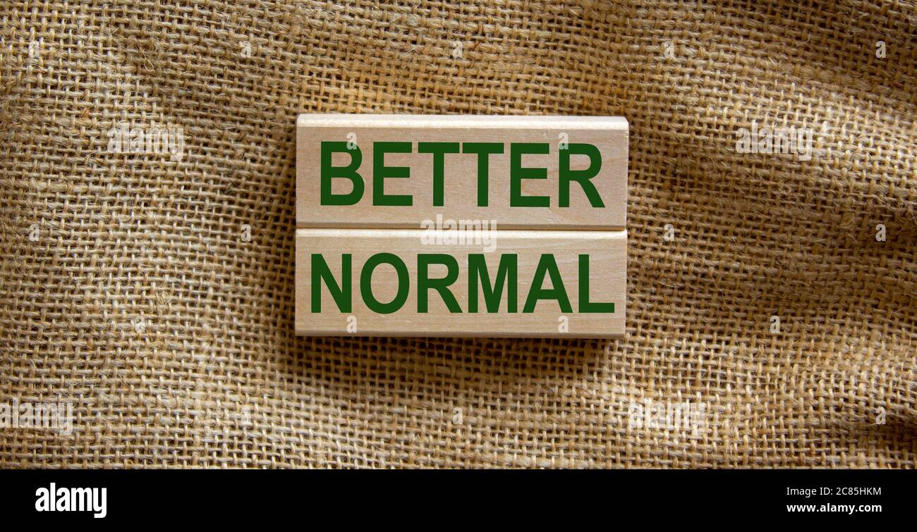 Wooden blocks with words 'better normal' on beautiful canvas background ...