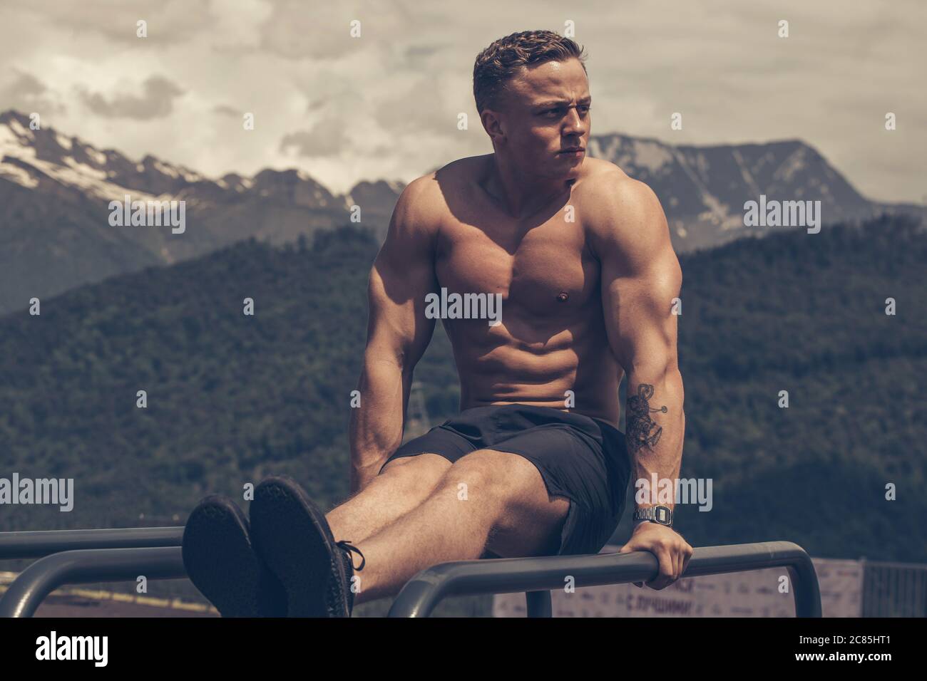 young blonde male athlete with focused and tensed face expression ...