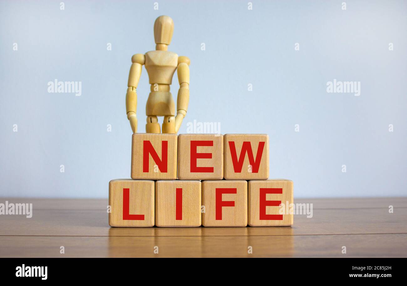 Concept words 'new life' on cubes on a beautiful wooden table. Wooden ...