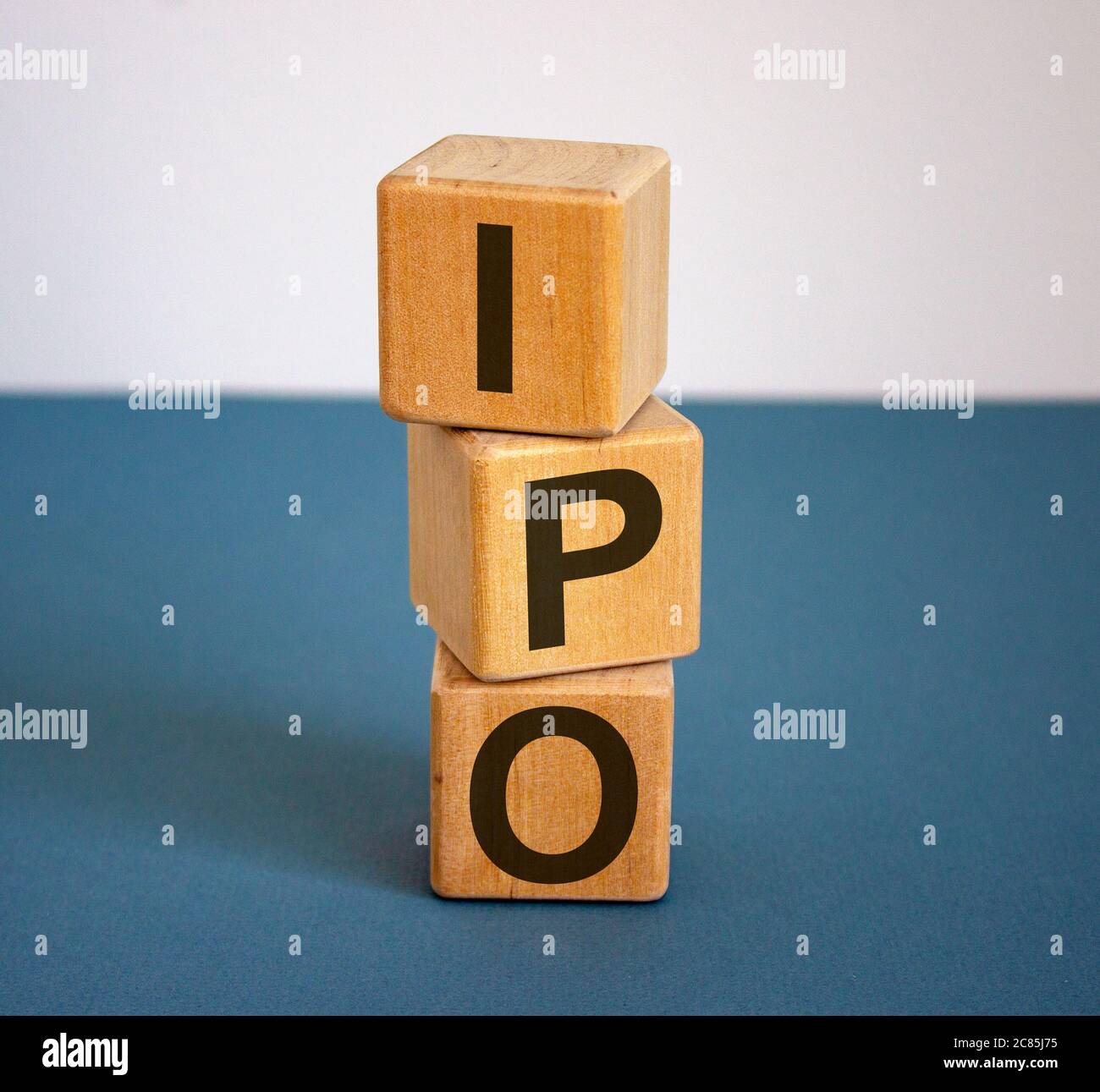 Concept word IPO on cubes on a beautiful blue background. Business ...
