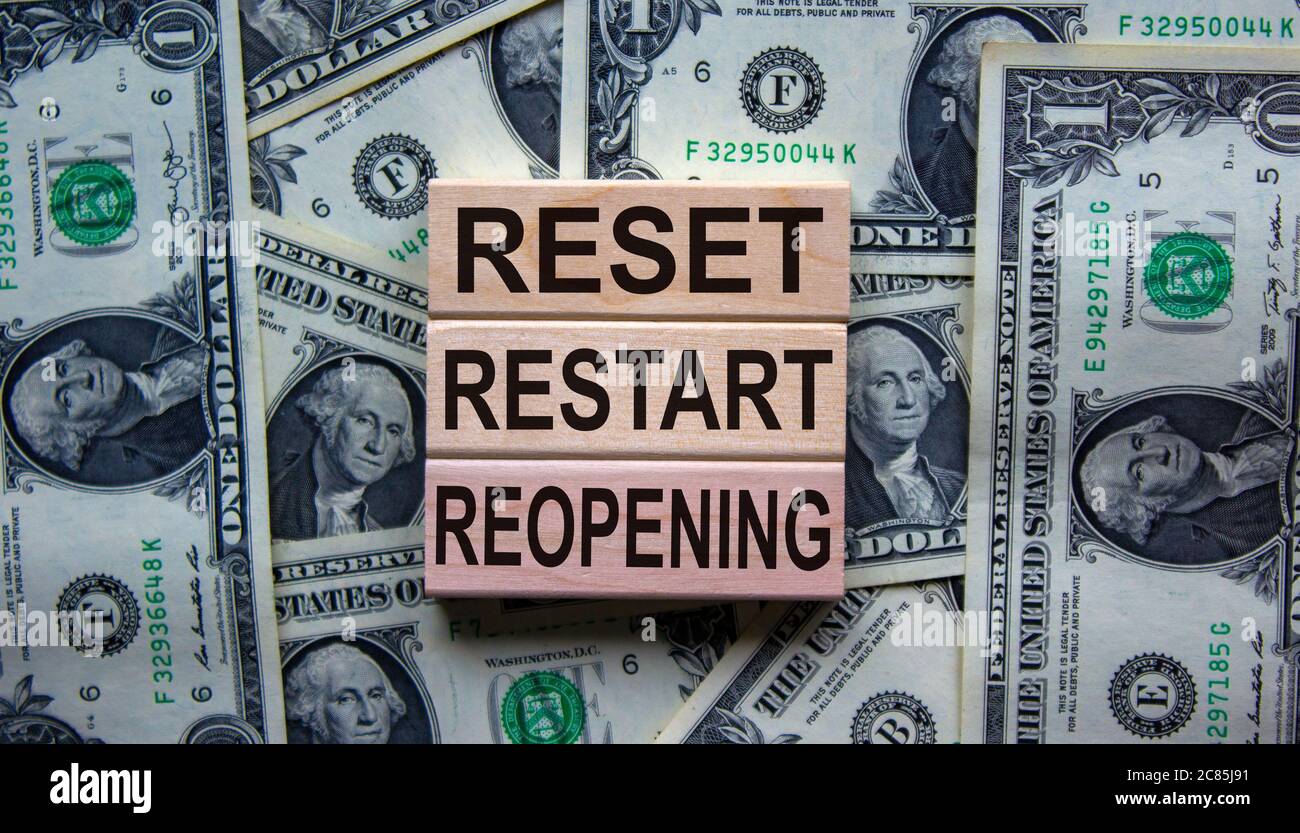 Concept words 'reset, restart, reopening' on wooden blocks on a ...