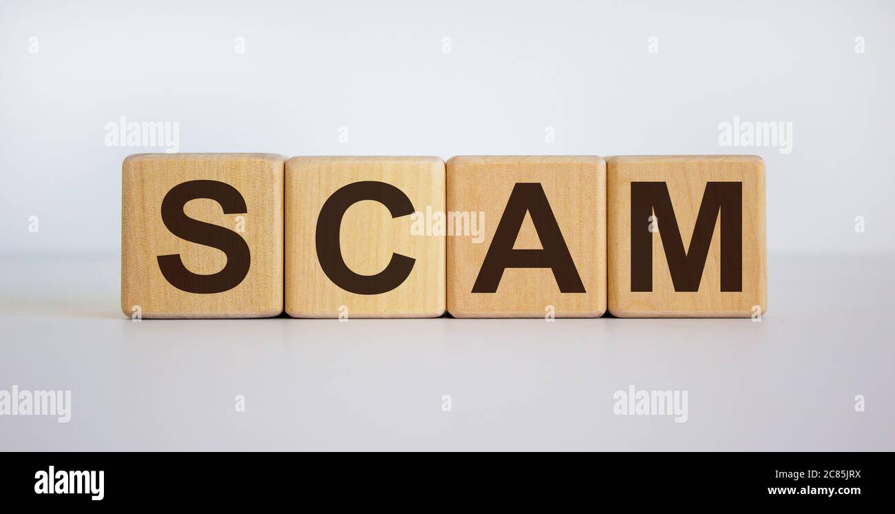 Wood cubes with word 'scam' on beautiful white background, copy space ...