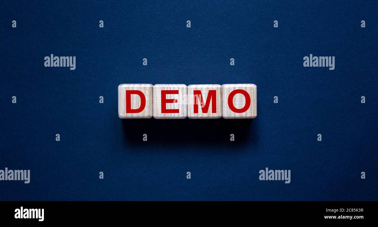 Concept word 'demo' on cubes on a beautiful dark background. Business ...