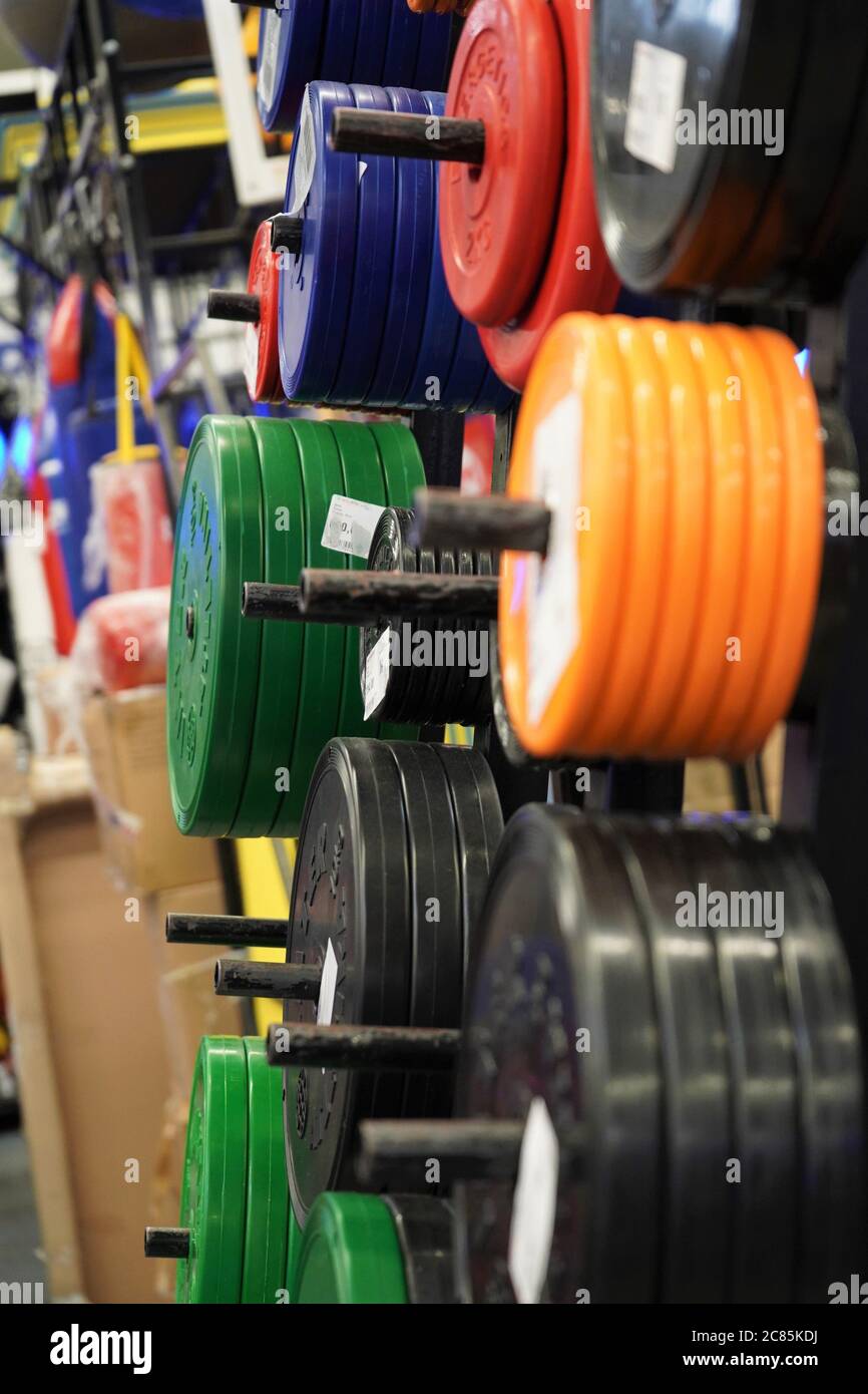 Sports goods sale in store,colorful weight plates.Healthy lifestyle ...