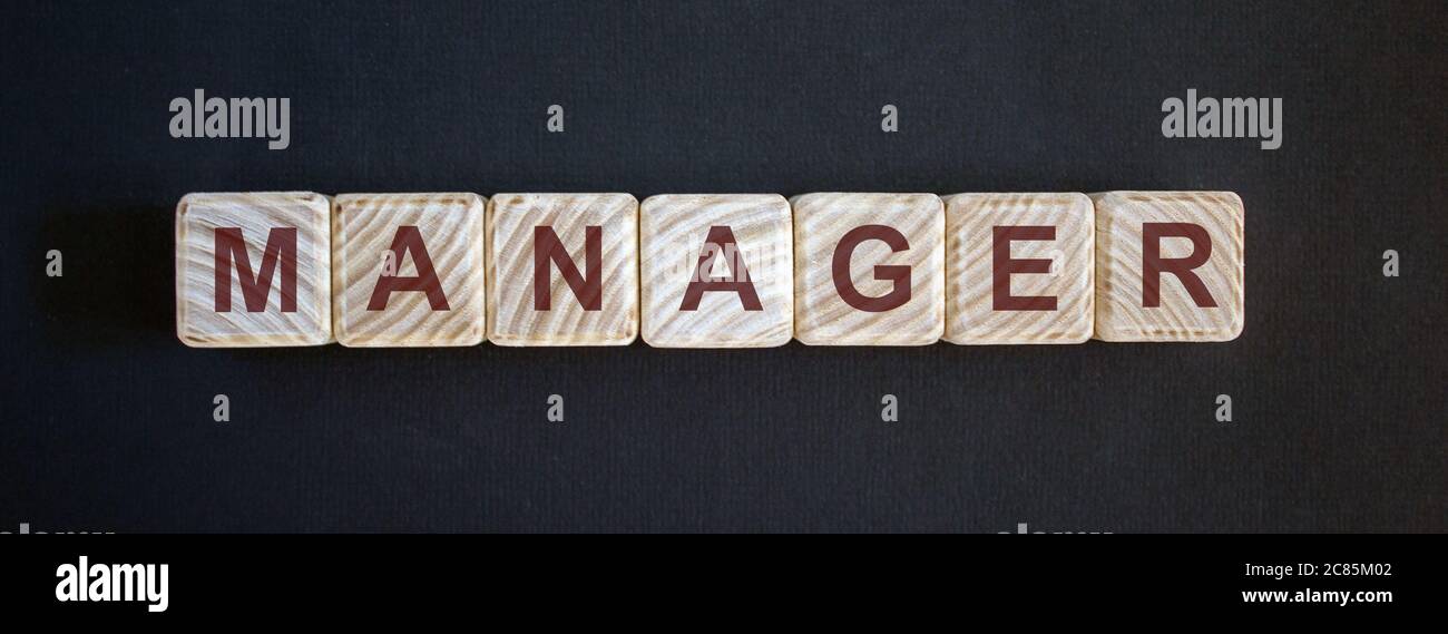 concept word manager on cubes on a beautiful dark background Stock ...