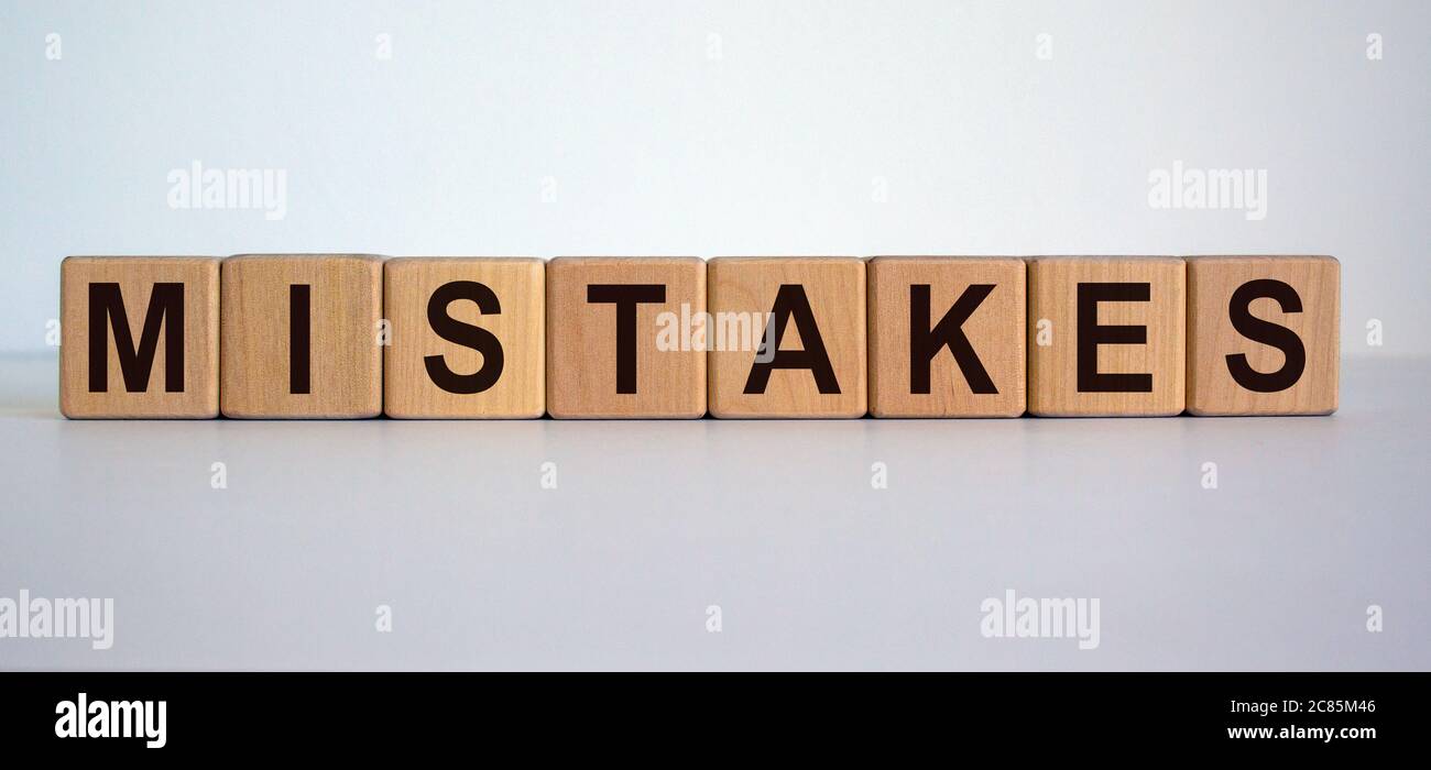 Concept word 'mistakes' on cubes on a beautiful white background Stock ...