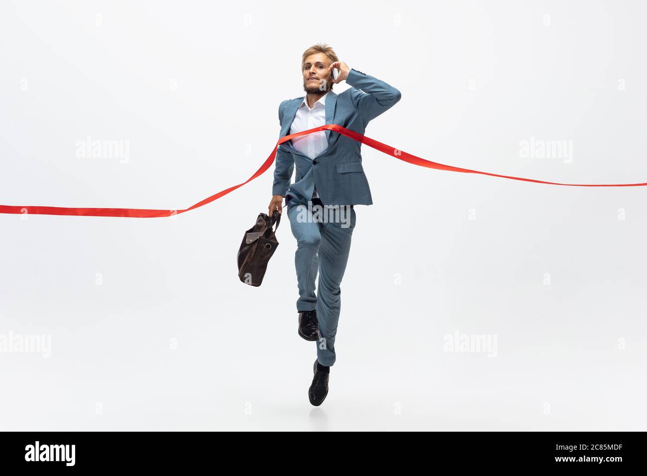 Career, success. Man in office clothes running, jogging on white ...