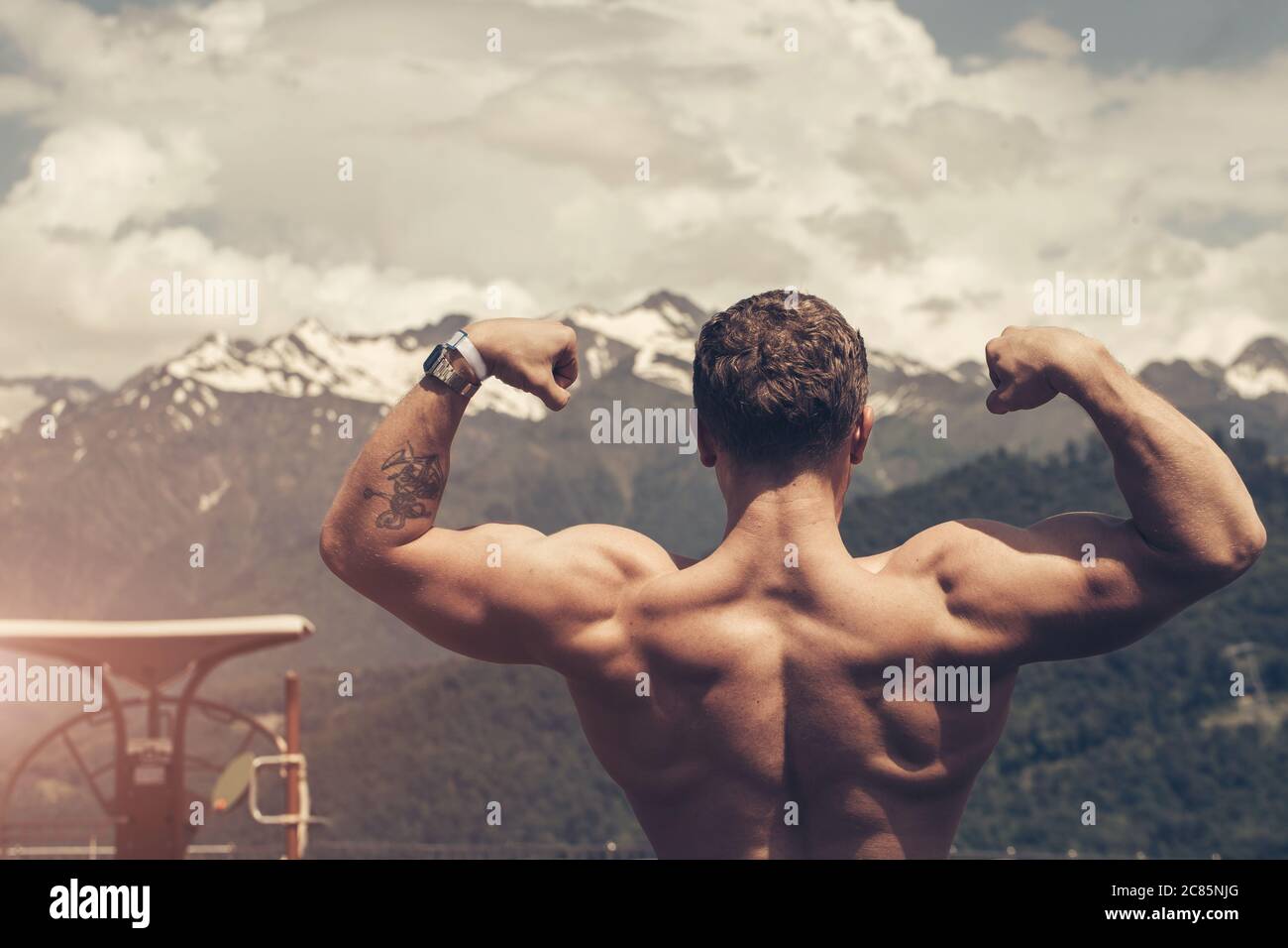 Young bodybuilder showing muscles shape outdoors, Handsome muscular ...