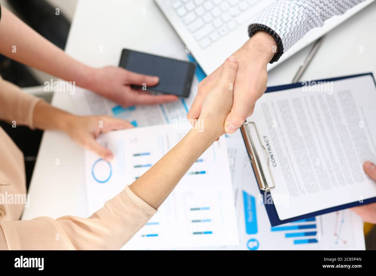 Close up of people that shaking hands Stock Photo - Alamy
