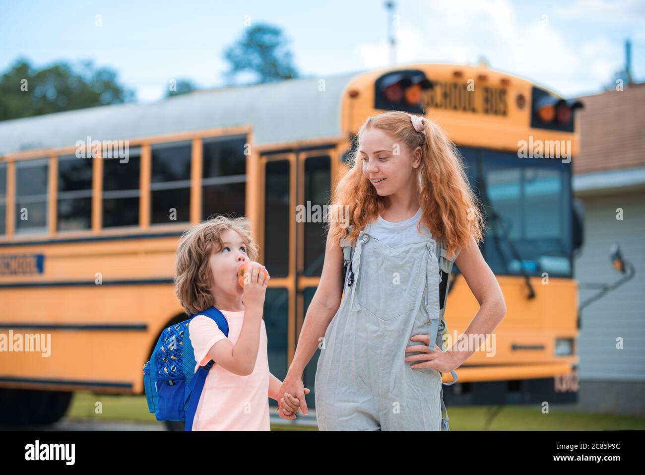 Child backpack getting on bus hi-res stock photography and images - Alamy