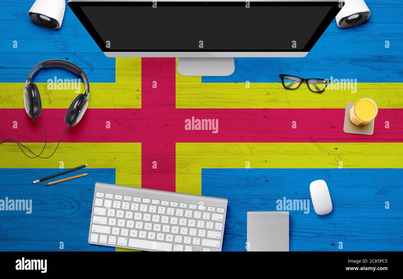 Aland Islands flag background with headphone,computer keyboard and ...