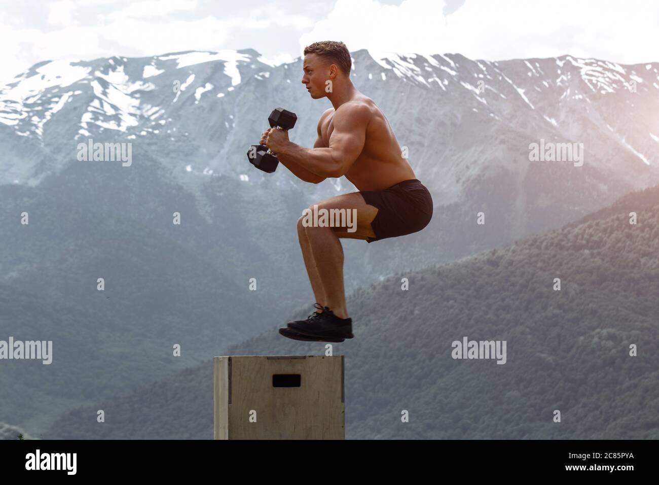 Sportsman fit male jumper doing explosive strength training jumps ...