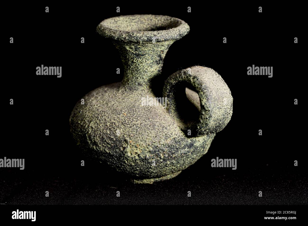 Closeup shot of an antique water jug isolated on black background Stock ...