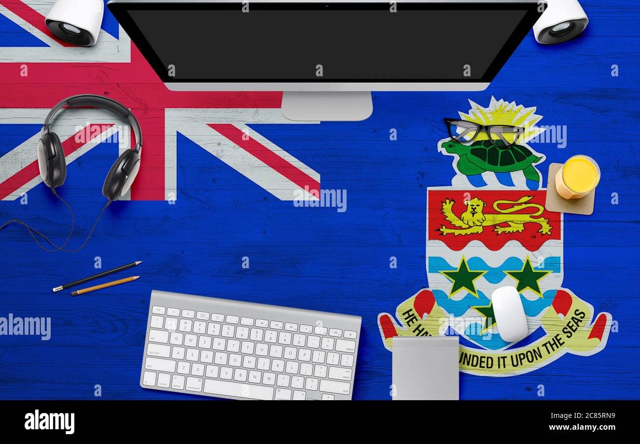 Cayman Islands flag background with headphone,computer keyboard and ...