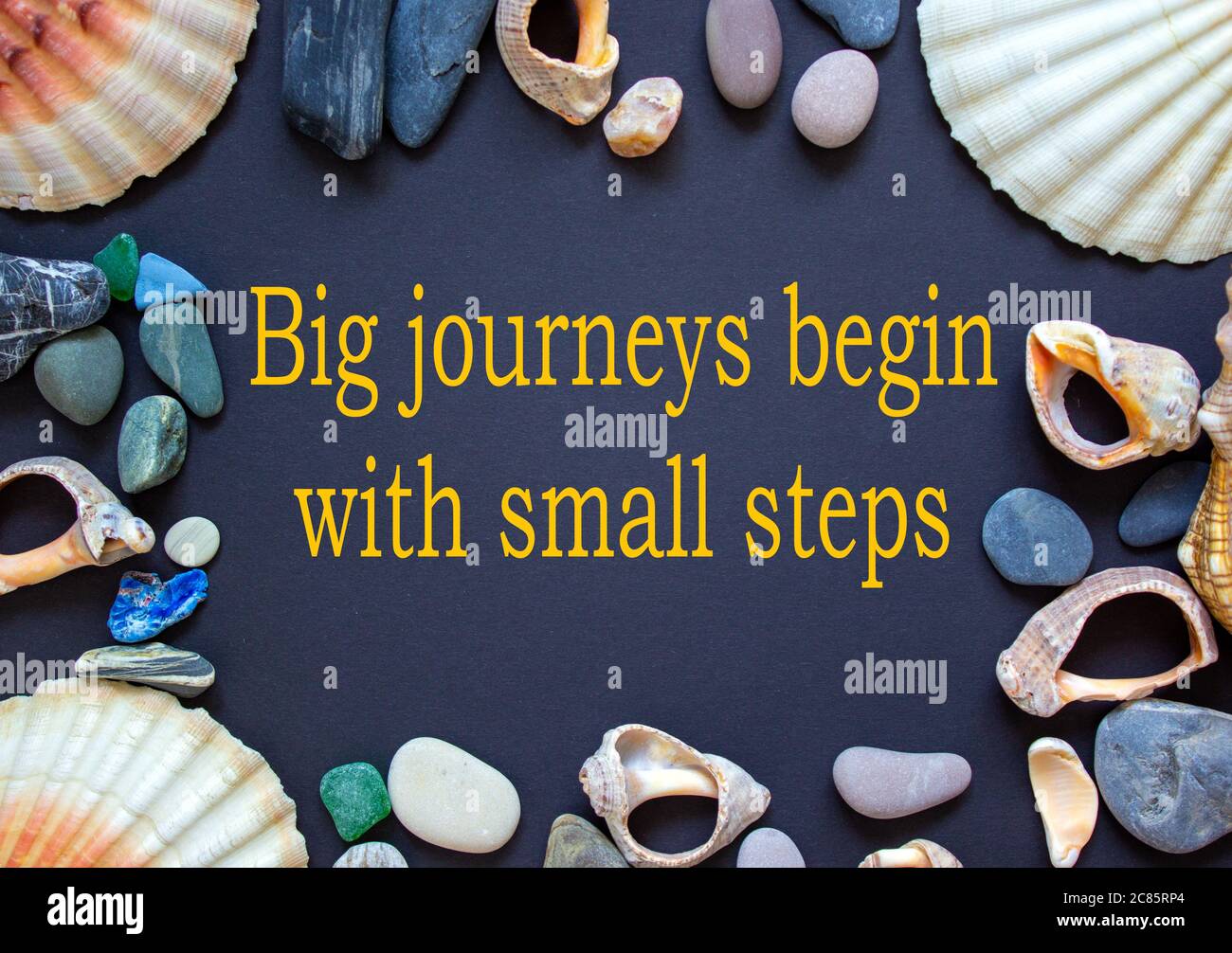 Text 'big journeys begin with small steps' on a beautiful black ...
