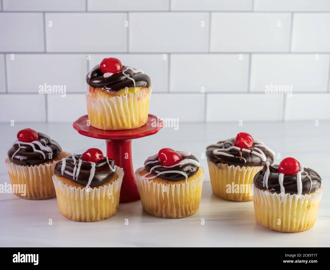 Delicious baked goods on a sandstone counter with a white subway tile ...
